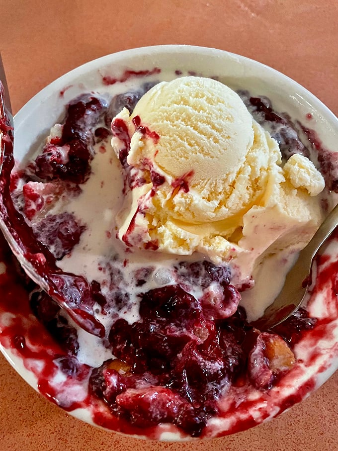 Berry bliss meets vanilla ice cream in a warm embrace. This blackberry cobbler doesn't need fancy plating—it's confident in its deliciousness.