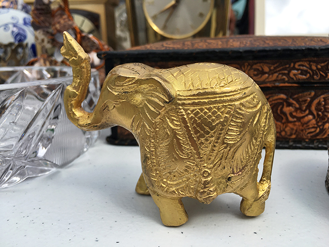 This little brass elephant isn't just decor – it's good luck with its trunk raised high. Grandma would call it "a proper conversation piece."