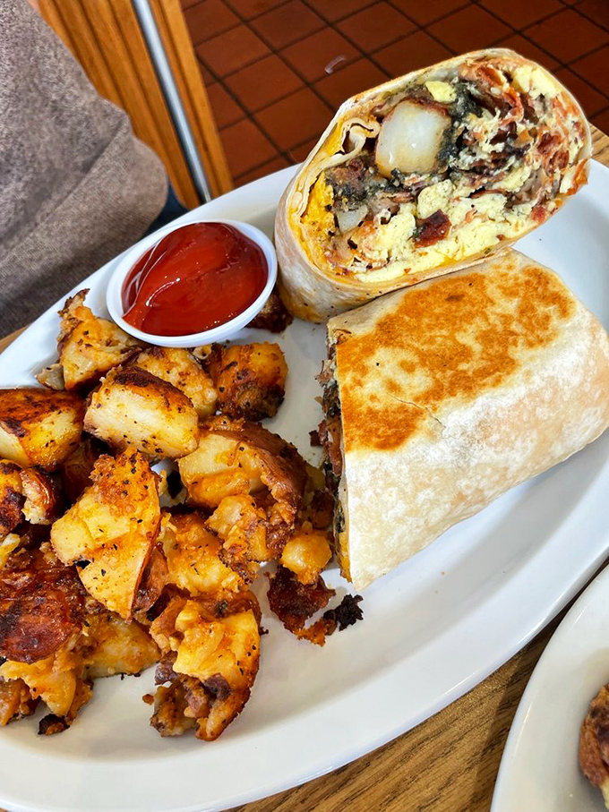 Breakfast burritos: where "morning" and "fiesta" collide in a tortilla-wrapped package that makes Monday feel like Saturday. Those home fries deserve their own fan club.