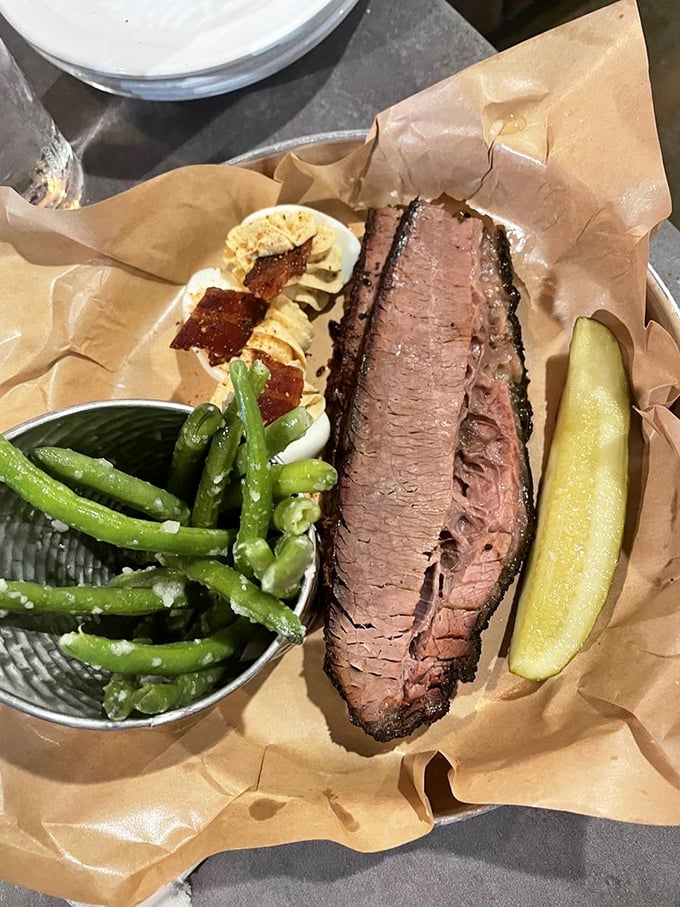 Brisket that's been pampered longer than most spa guests. The pink smoke ring is nature's way of saying "you've made an excellent life choice today."