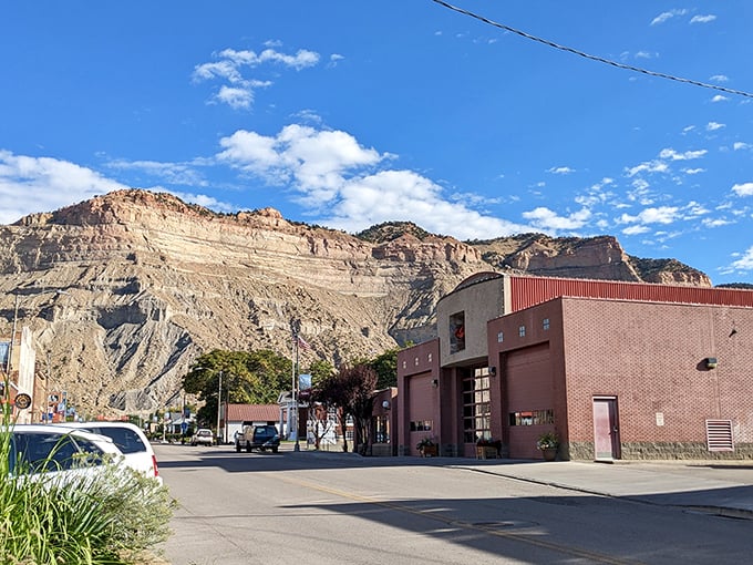 These brick buildings have witnessed a century of Helper history, standing strong against time while the mountains behind remain eternal witnesses.