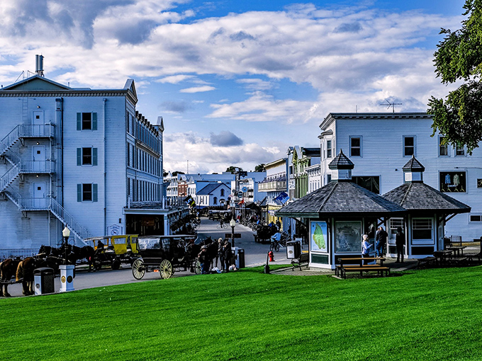 Horse-drawn carriages wait patiently as downtown bustles with the gentle rhythm of a place where nobody's checking their watch.