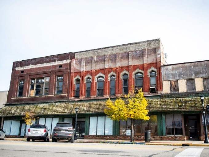 These weathered storefronts tell stories of economic cycles, patiently waiting for their next chapter while offering space for budget-friendly entrepreneurship.