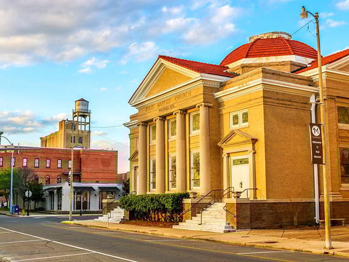 First Baptist Church's golden-hued facade glows in the evening light, a landmark that's witnessed generations of Monroe residents through life's celebrations and challenges.