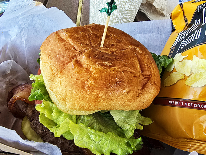 This isn't some fancy gastropub creation – it's an honest-to-goodness burger that requires both hands, a stack of napkins, and zero pretension.