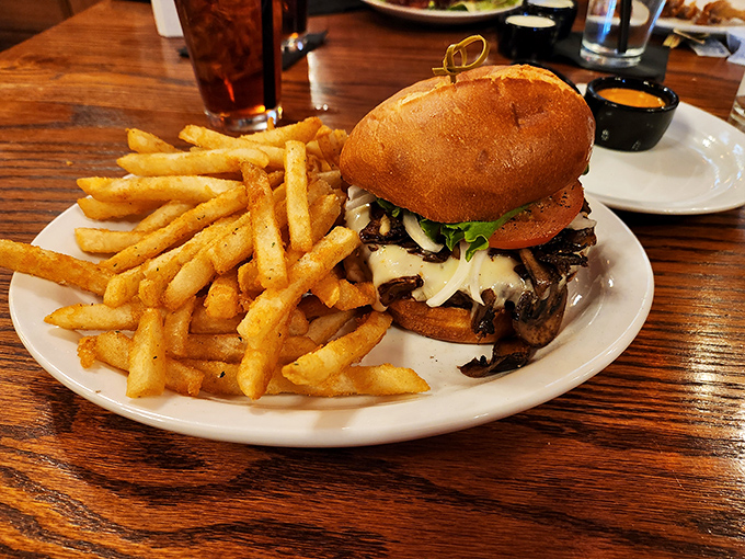 This isn't just a burger&mdash;it's architecture. Towering layers of beef, cheese, and toppings demand both your respect and a strategic eating plan. 