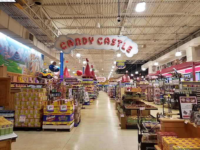 Sugar rush headquarters! The "Candy Castle" sign isn't kidding around&mdash;this sweet section houses enough confections to make Willy Wonka consider a career change.