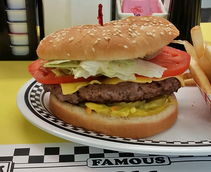 Behold the burger in its natural habitat: thick, juicy, and adorned with fresh toppings on a sesame seed throne. Fast food chains weep with envy.