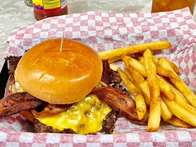 Bacon and cheese transform an already legendary burger into something that should require a permission slip. The fries stand at attention, ready for their dipping destiny.