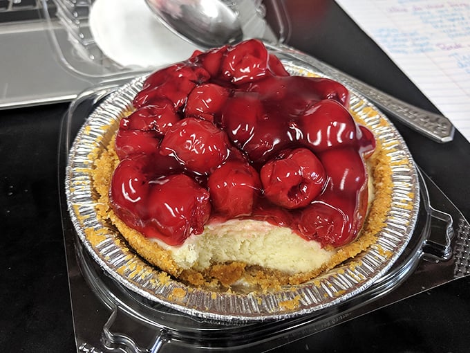 This cherry cheesecake isn't just dessert; it's a ruby-crowned celebration waiting to happen. The glistening fruit practically winks at you.