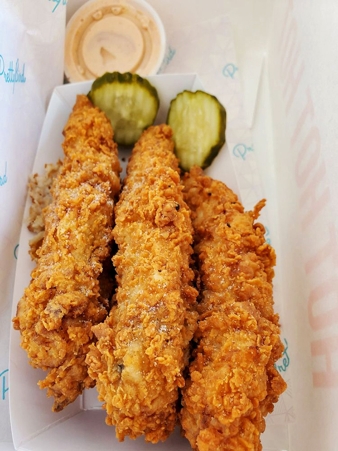 These chicken tenders aren't just golden&mdash;they're the Fort Knox of fried chicken, guarded by pickle sentinels standing watch.