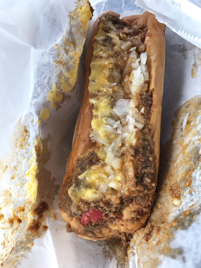 Behold the holy trinity of Jimmie's chili cheese dog: perfectly melted cheese, that signature fine-ground chili, and a hot dog that snaps with each bite.