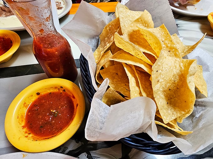 Chips and salsa—the opening act that steals the show. Crispy, house-made tortilla triangles ready to dive into that vibrant, freshly-made salsa pool.