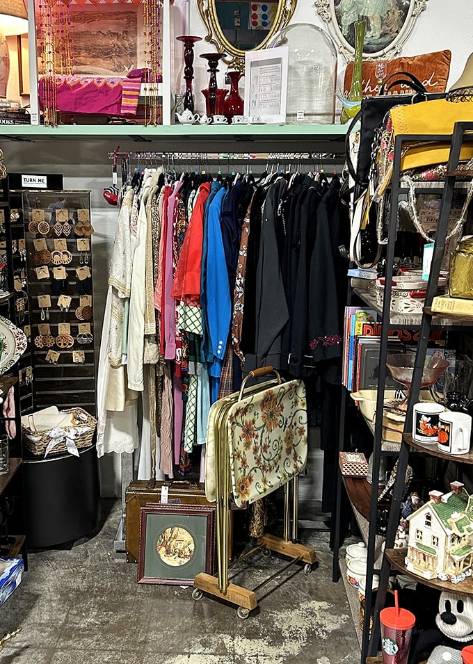 Vintage clothing racks organized by someone who understands that thrift shopping shouldn't require archaeological skills or patience.