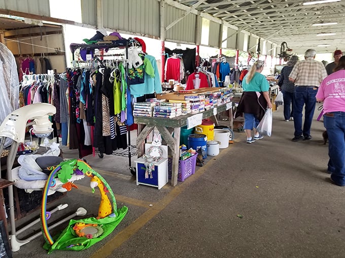 The clothing rainbow effect. Racks of colorful garments stand ready for their second act, while shoppers hunt for that perfect piece at a fraction of retail.