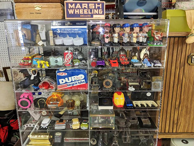 This display case is a time capsule of Americana, where vintage toys and collectibles patiently wait for their next caretaker.