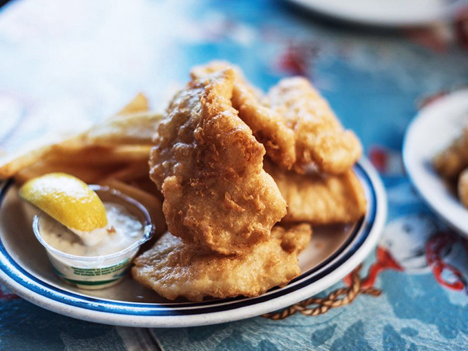 Golden-battered fish that shatters with each bite, revealing the tender white fish within. The ocean never tasted so good on land.