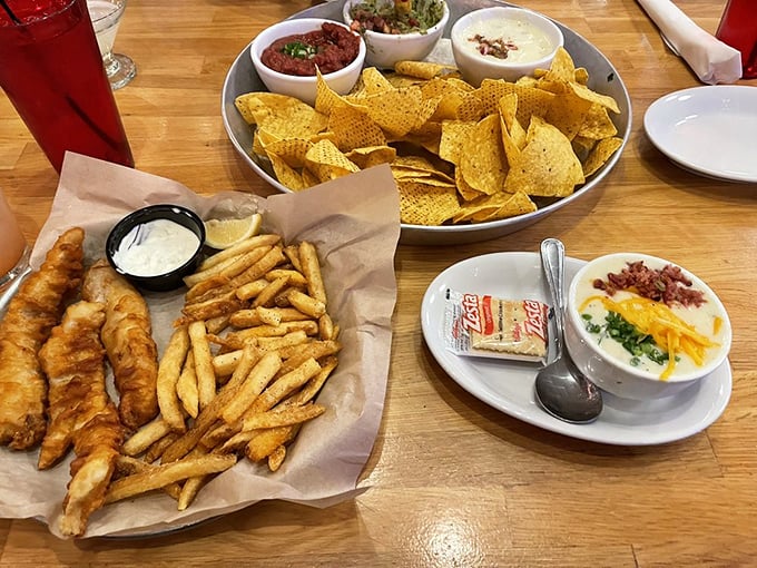 The fish and chips arrive with the confidence of an old friend, golden-battered and crispy, while a loaded baked potato soup stands by for dipping duty.