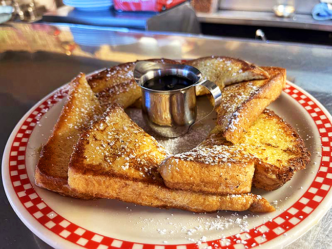French toast that's dressed for success with a dusting of powdered sugar. That little cup of syrup is just waiting to transform breakfast into dessert.