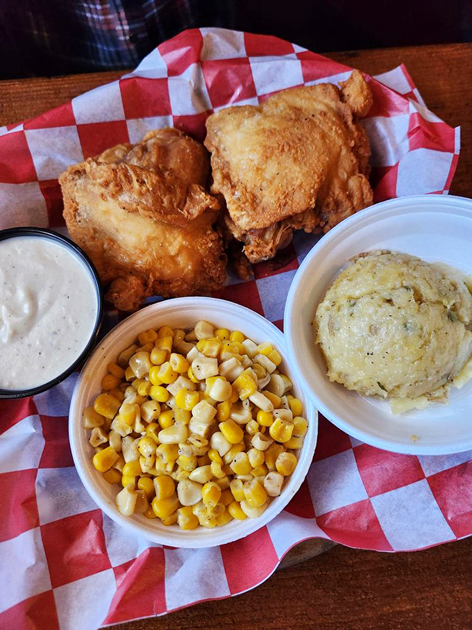 Comfort food trinity: perfectly fried chicken, sweet buttered corn, and cloud-like mashed potatoes. Some traditions don't need reinventing, just perfecting.
