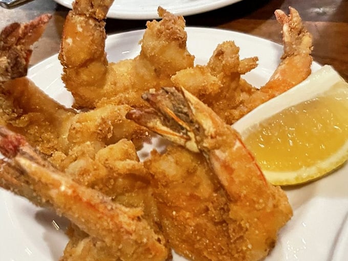 Golden fried prawns that crunch like autumn leaves but taste infinitely better than your yard work rewards.