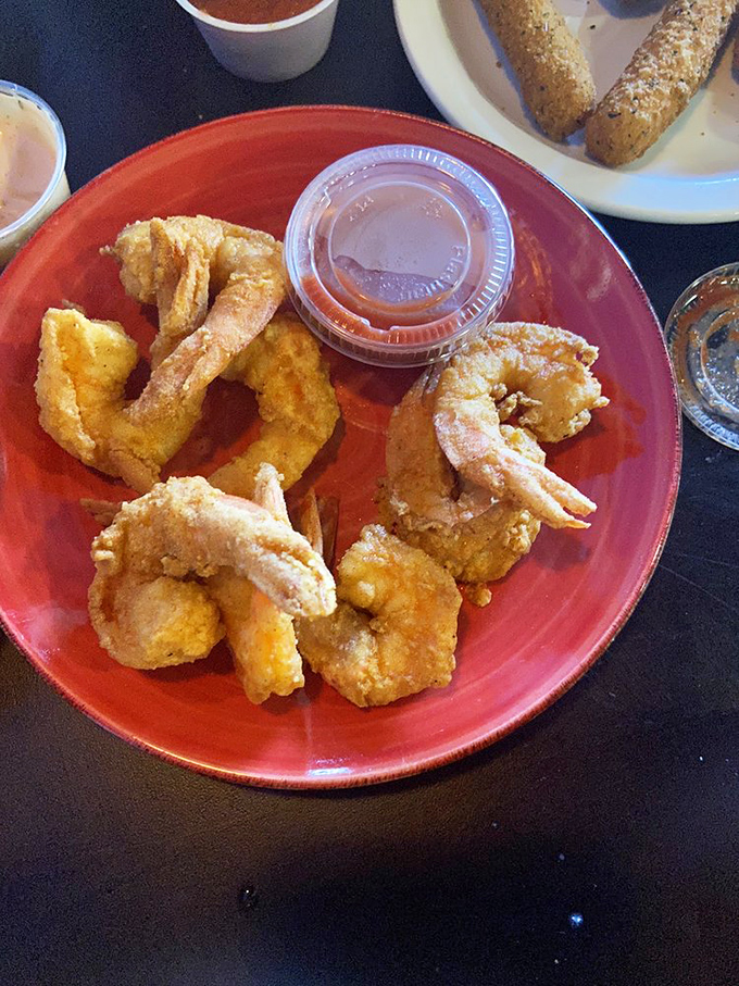 These golden-fried shrimp aren't just appetizers; they're little crispy preludes to the seafood symphony that awaits. Dipping sauce required!