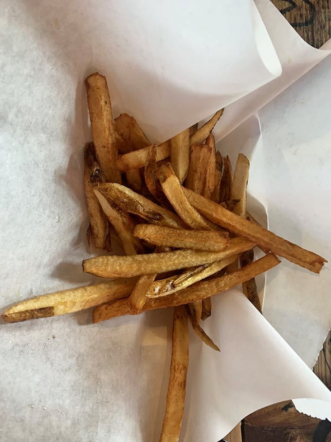 Hand-cut fries that achieve the golden trifecta: crispy exterior, fluffy interior, and just enough salt to make you reach for another. And another.