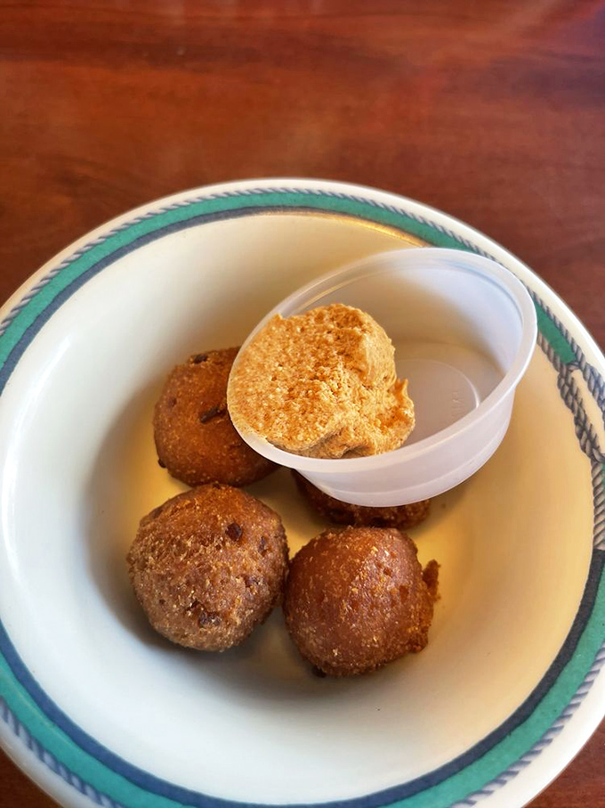 Hush puppies golden and crisp as Florida sunshine, these cornmeal gems are the unsung heroes of any proper seafood feast.