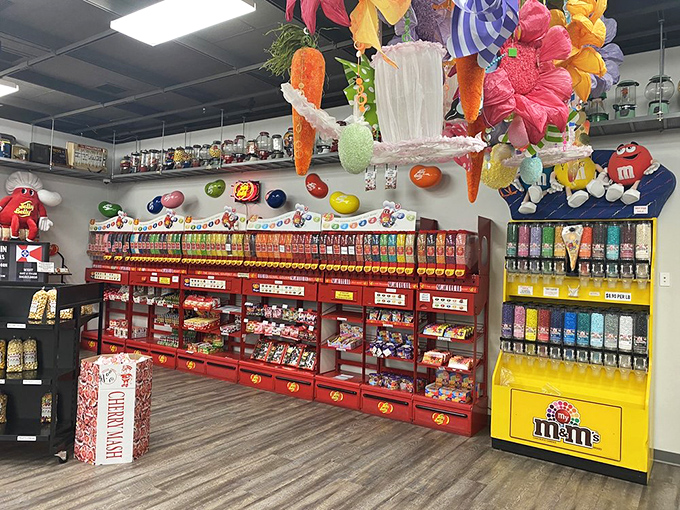 M&M's dispensers standing like colorful sentinels guarding a kingdom of confections. The candy equivalent of the Buckingham Palace guards.