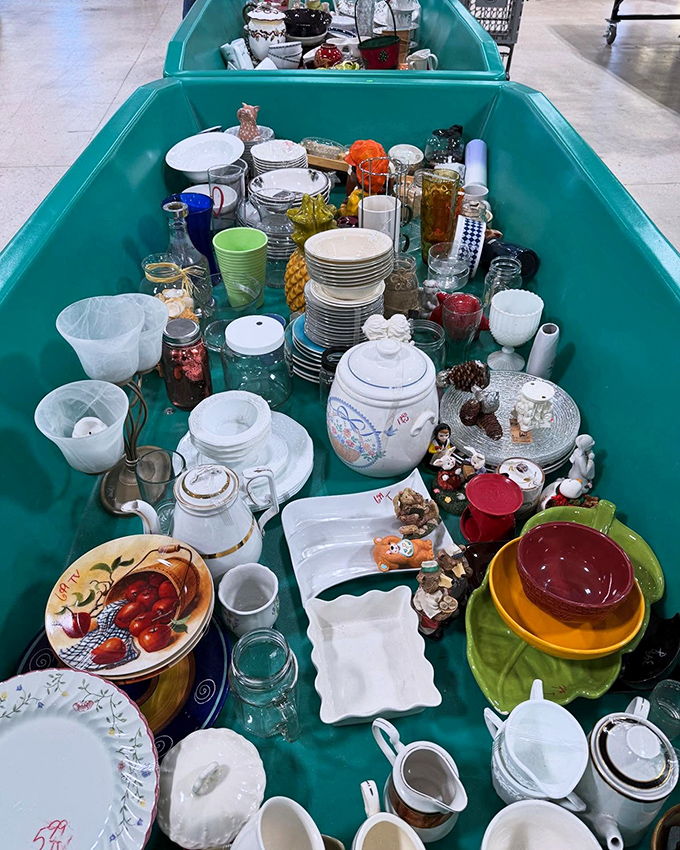 Kitchen treasures overflow like a culinary yard sale, where mixing bowls and memories blend at bargain prices.