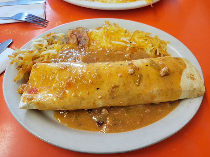 This breakfast burrito isn't just a meal, it's a commitment. Smothered in green chili that could wake up even the most stubborn taste buds.