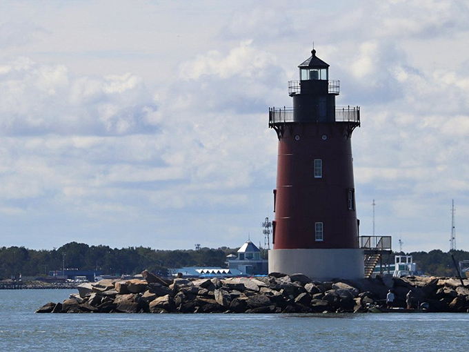 Delaware's crimson sentinel has guided mariners since 1885. At sunset, it transforms from lighthouse to living postcard.