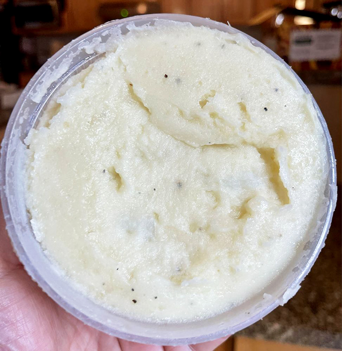 Cloud-like mashed potatoes that could make a carb-counter weep with joy. Butter and seasoning whisper their presence in every velvety bite.