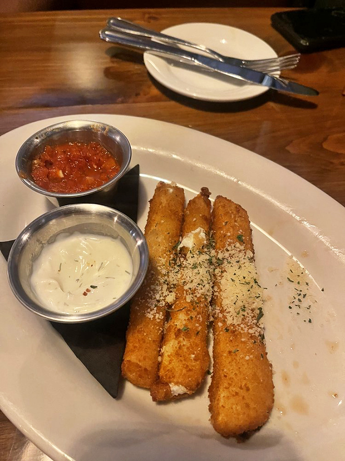 Golden-fried mozzarella sticks with dipping sauces that make you forget every disappointing appetizer plate you've ever encountered. Crispy, cheesy perfection!