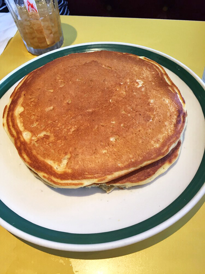 Pancakes so perfectly golden they deserve their own Olympic medal. The maple syrup is just waiting in the wings for its starring role.