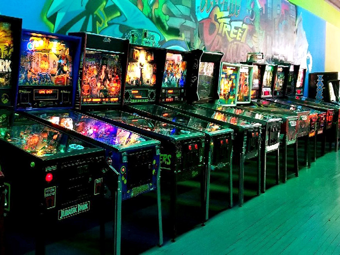 Pinball wizards, your kingdom awaits. This row of mechanical marvels proves that sometimes the most satisfying gaming experience still involves a steel ball and gravity.
