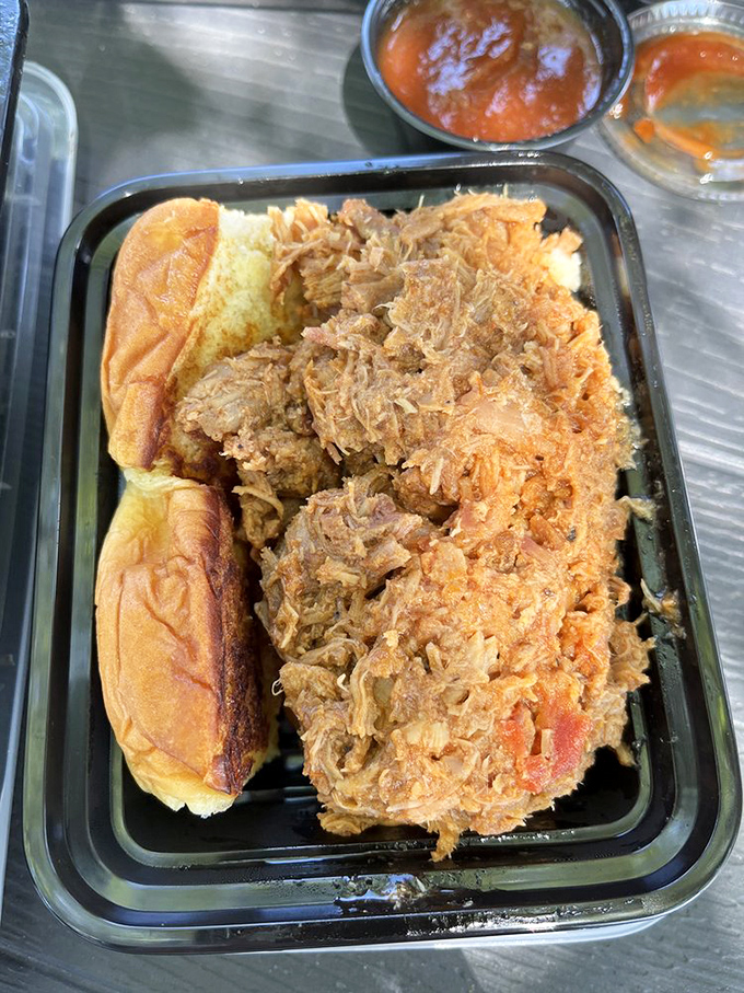 Pulled pork that's actually been pulled, not chopped into submission. Each strand maintains its dignity while collectively creating a sandwich-worthy masterpiece.