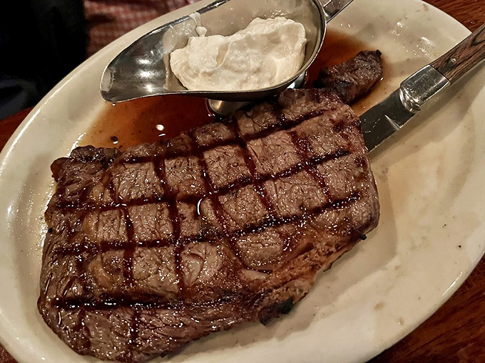 Grill marks that deserve their own art exhibition. This ribeye's marbling has achieved the perfect balance between lean meat and flavor-carrying fat.