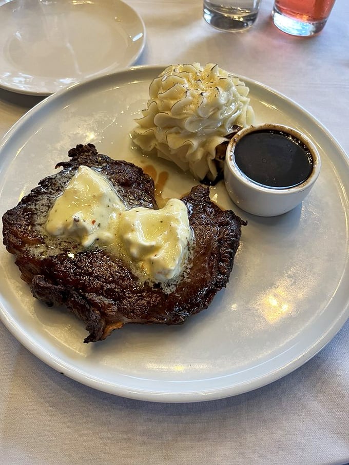 A ribeye so perfectly prepared it practically moos with satisfaction on your plate, butter melting gracefully.