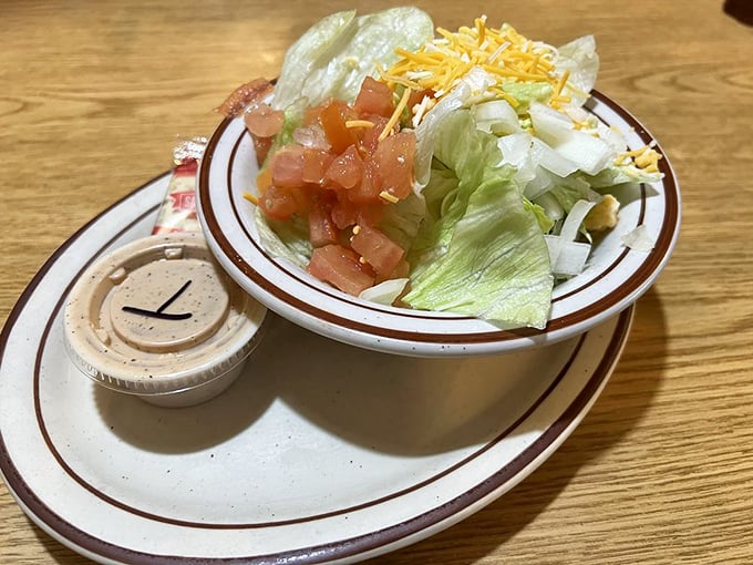 Even the side salad gets the respect it deserves&mdash;crisp lettuce, fresh tomatoes, and shredded cheese waiting for its moment in the spotlight.
