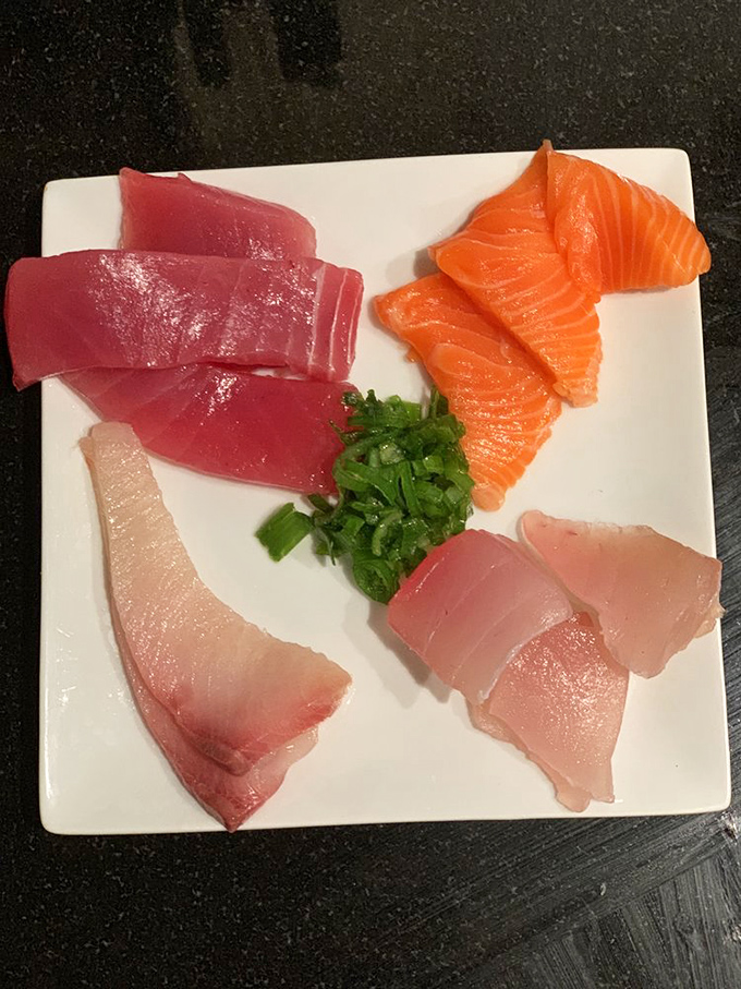 Sashimi arranged with the precision of a Swiss watchmaker. Each slice is a perfect jewel-toned promise of ocean freshness.