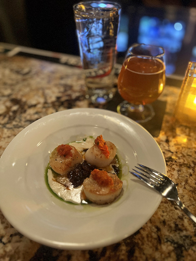 Scallops seared to golden perfection, like little ocean-flavored medallions of joy. The plate practically whispers "special occasion."