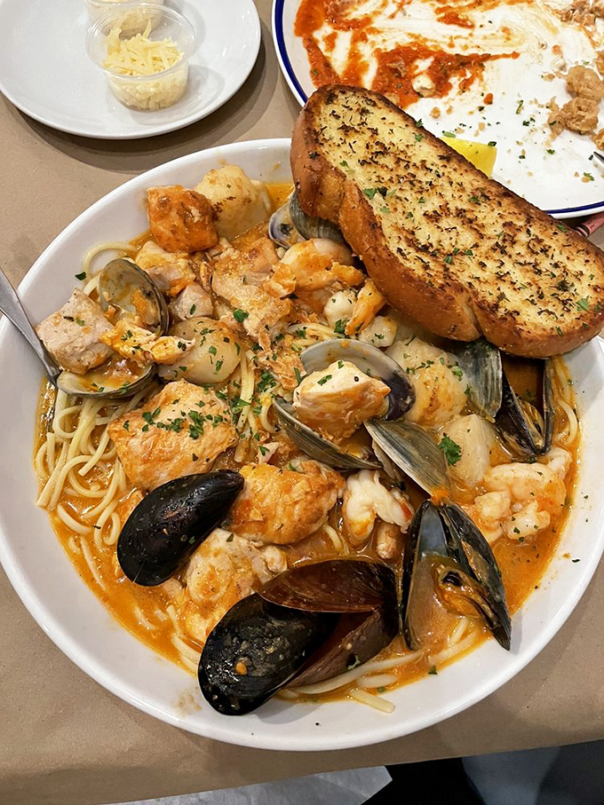 Pasta swimming in seafood glory—where mussels, clams, and perfectly cooked fish have found their ultimate happy place.