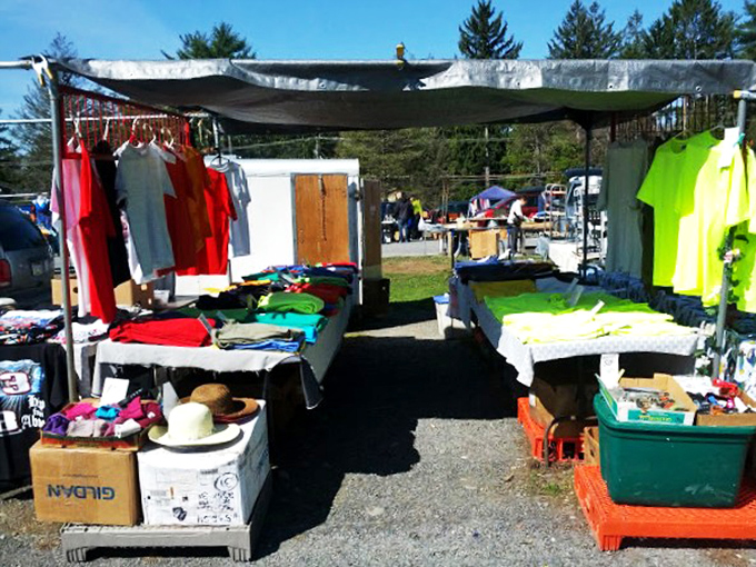 Under canvas canopies, rainbow arrays of t-shirts and summer wear await new owners who appreciate both bargains and second chances.