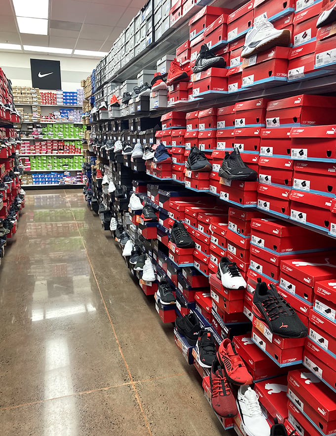 The wall of Nike shoes stretches to infinity, a monument to human optimism that the perfect sneaker exists.