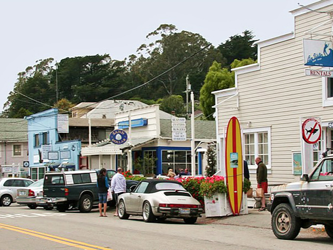Surf culture meets small-town charm along Stinson's main drag, where colorful storefronts and that classic surfboard sentinel announce you've arrived somewhere special.