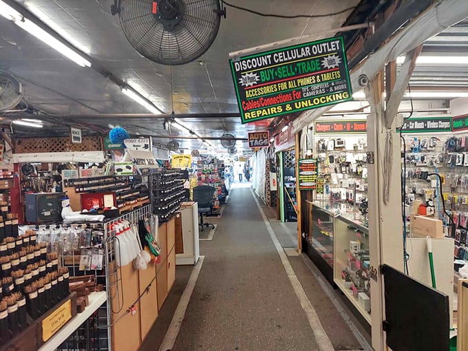 Cell phone repair meets vintage electronics in this tech alley&mdash;proof that at Fleamasters, there's a solution for every modern problem and retro obsession.