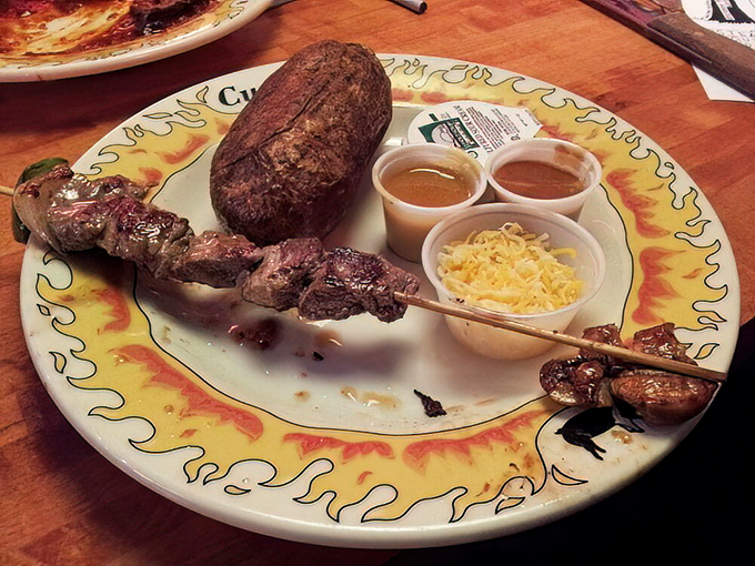 Steak on a stick &ndash; because sometimes the best dining experiences come when meat meets fire meets simplicity. Those sauces aren't just accessories, they're essential companions.