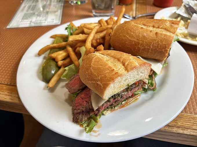 This isn't just a sandwich&mdash;it's architecture. Perfectly pink steak, crusty bread, and fresh greens creating the Taj Mahal of lunch options.