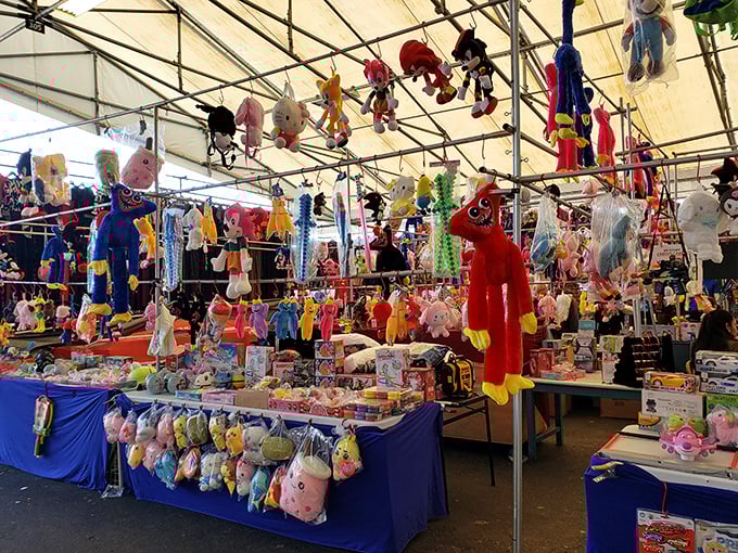 Stuffed animals dangle overhead like a carnival came to visit and decided to stay for the weekend.